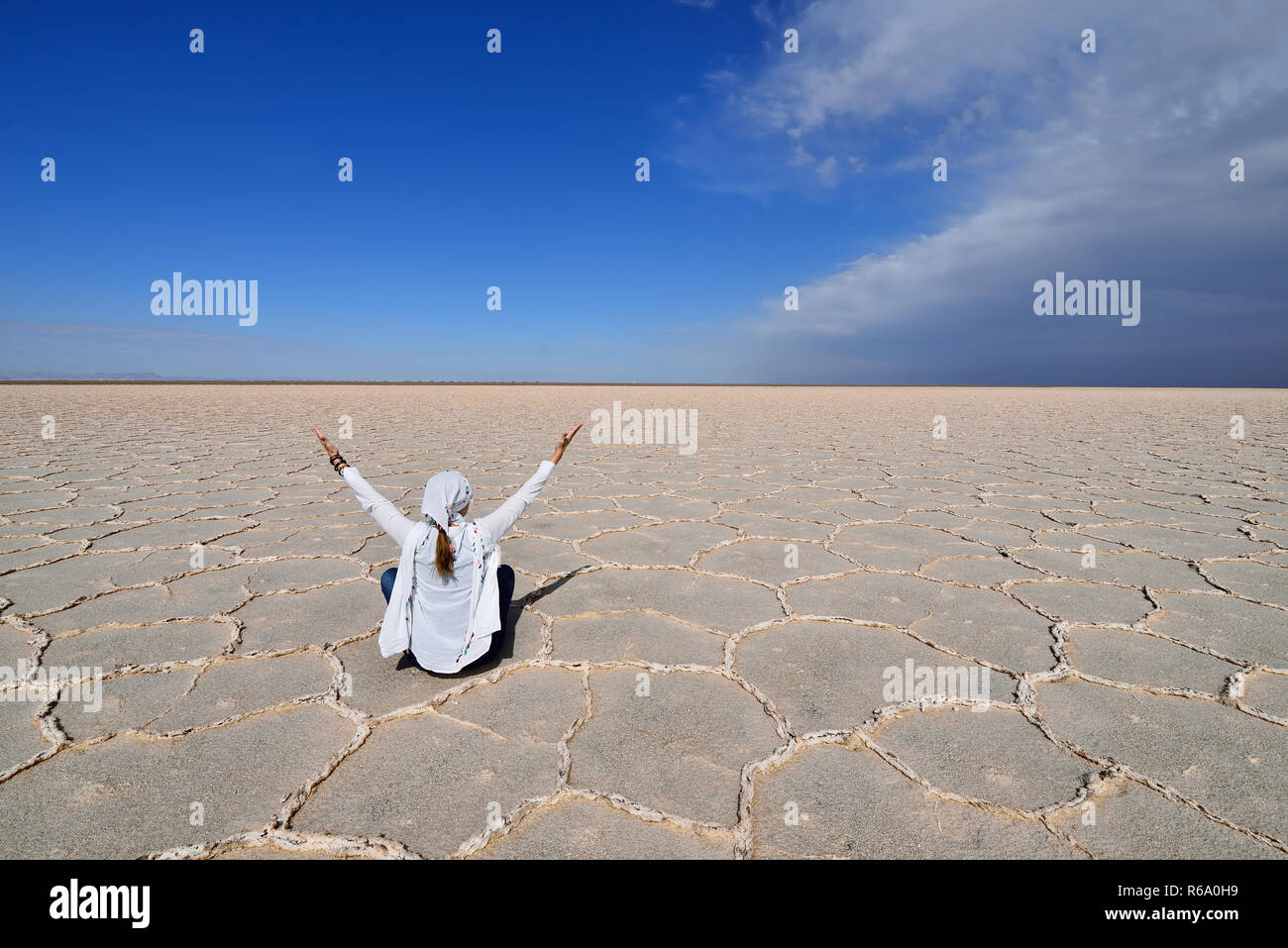 Iran, Tourist on the Great Salt Desert is a large desert lying in the ...