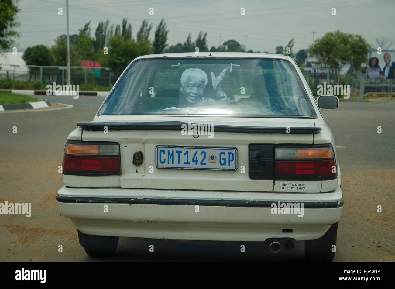 A car with a picture of Nelson Mandela waving (goodbye) is seen leaving ...