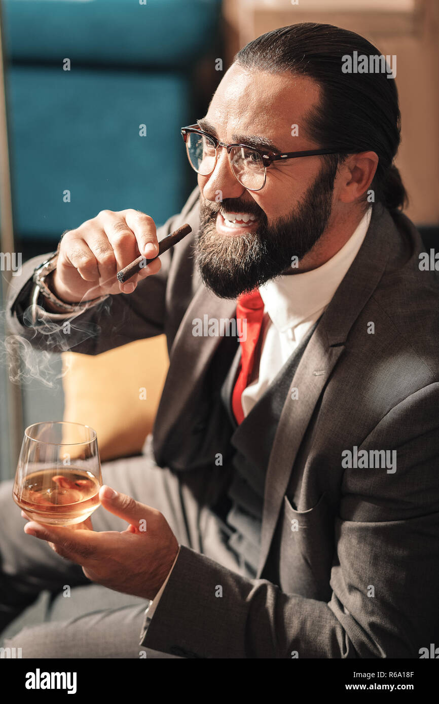 Exhausted nervous man smoking cigar and looking into window Stock Photo ...