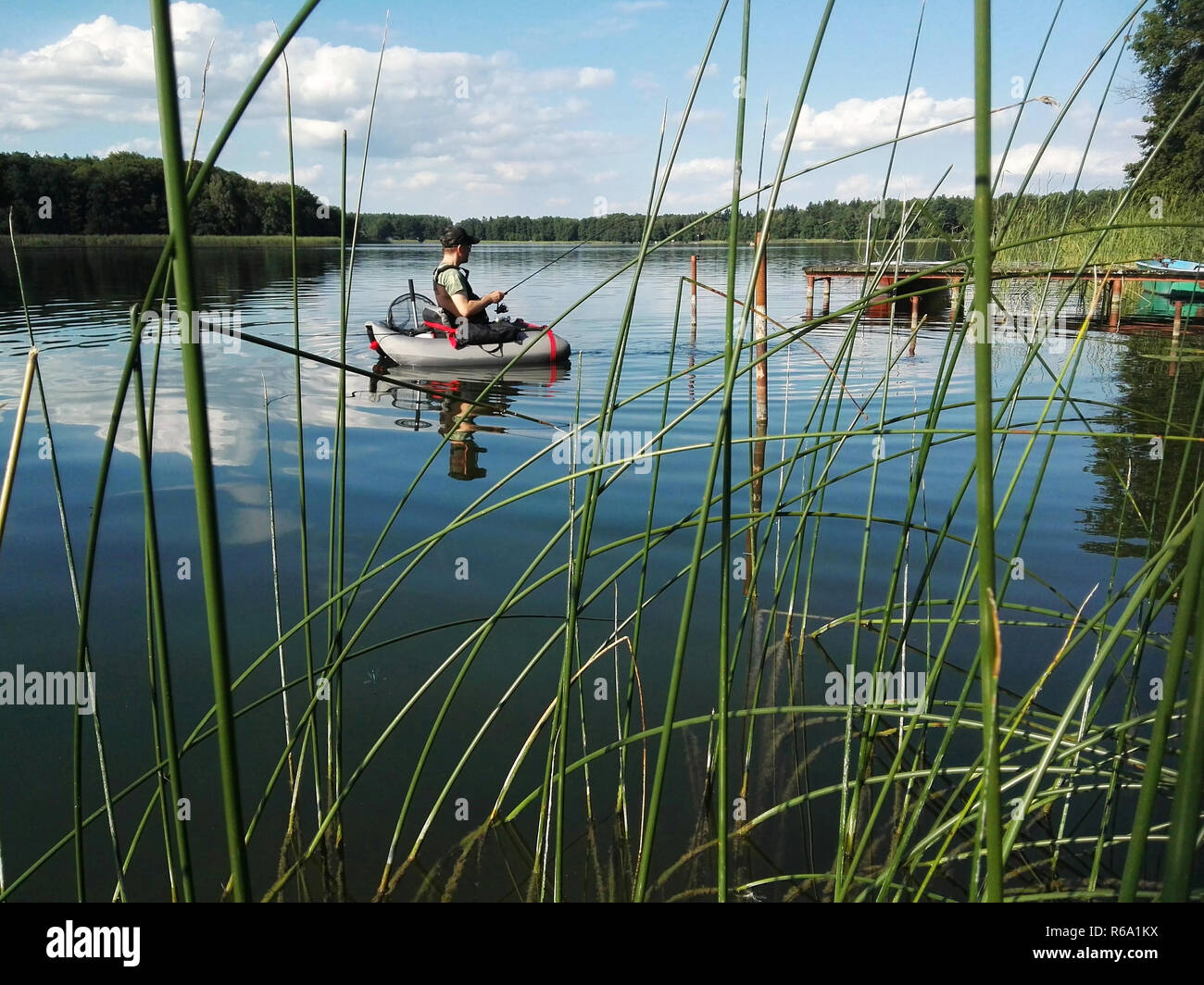 Angler With Belly Boat Stock Photo - Alamy