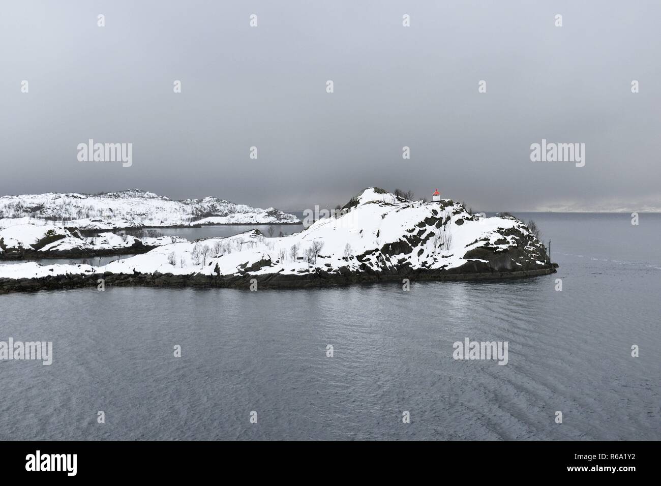 Small rock island with a small navigation mark on it in the north ...