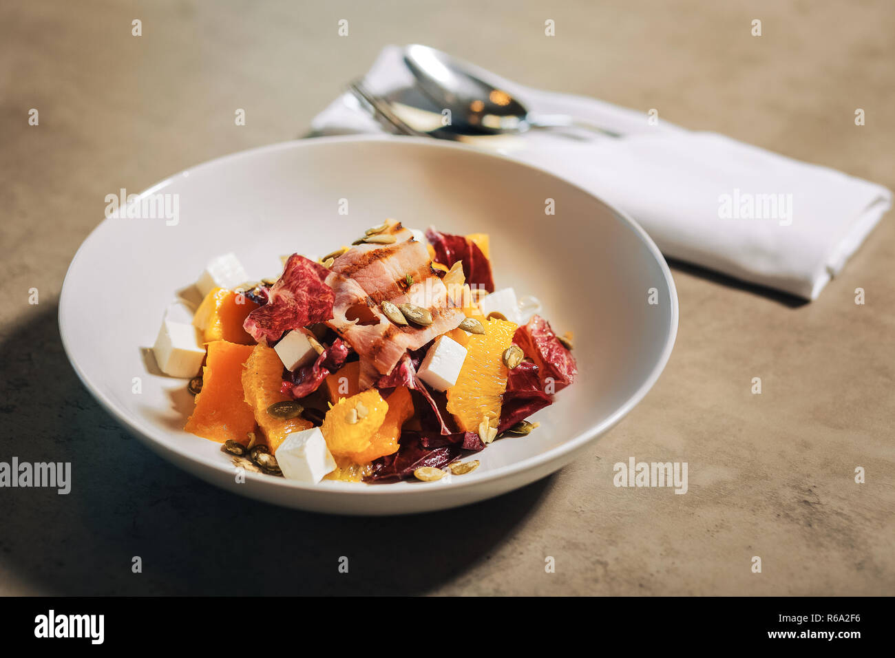 Tasty healthy salad bowl with feta cheese and bacon Stock Photo - Alamy