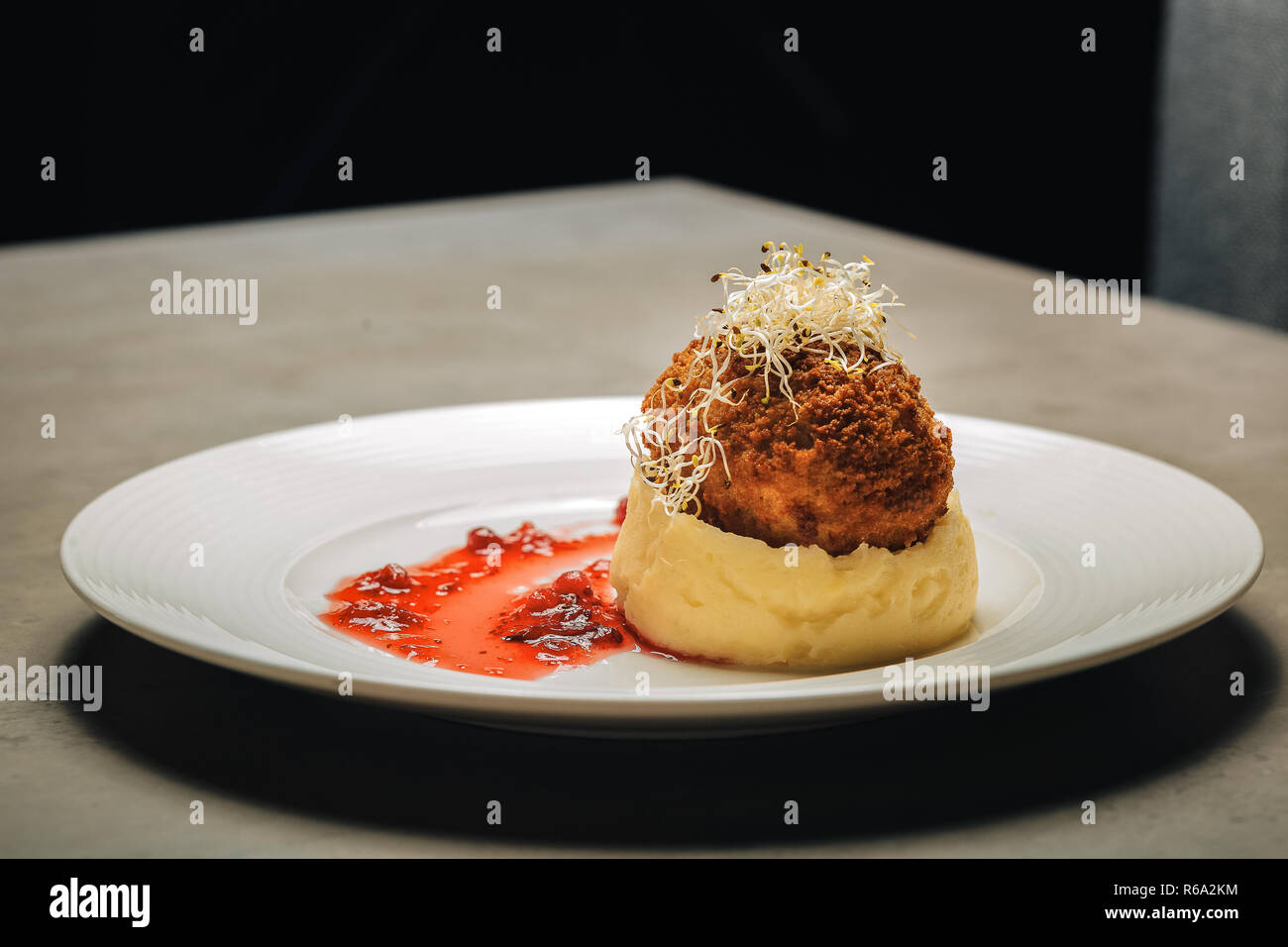 Mashed potatoes and chopped meat with wheat germs on top Stock Photo ...