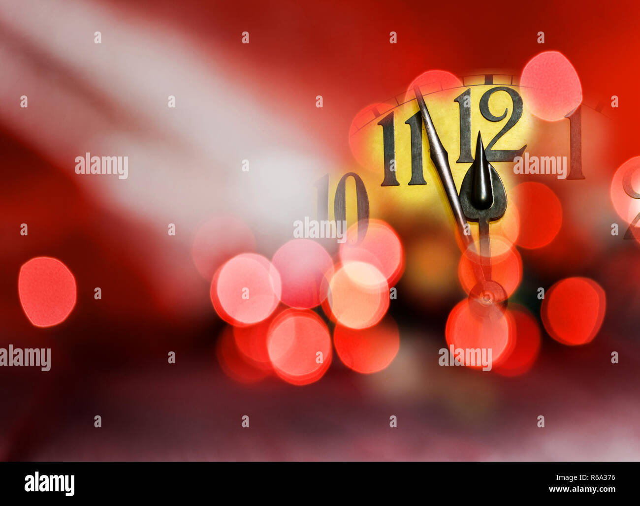 Detail of clock face on the red before midnight Stock Photo - Alamy