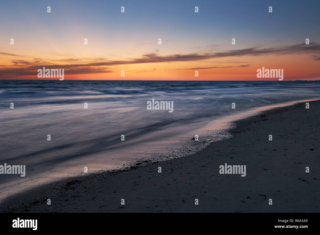 Yellow, orange and blue colors in twilight after sunset illuminate the ...