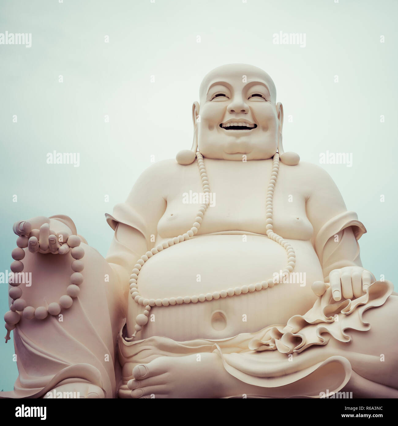 Massive statue of the Sitting Smiling Buddha at the Vinh Tranh Pagoda ...