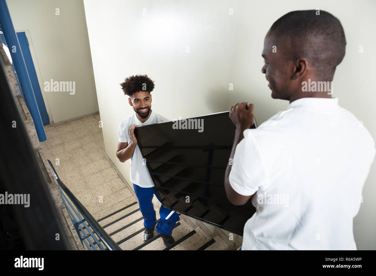 Carrying television hi-res stock photography and images - Alamy