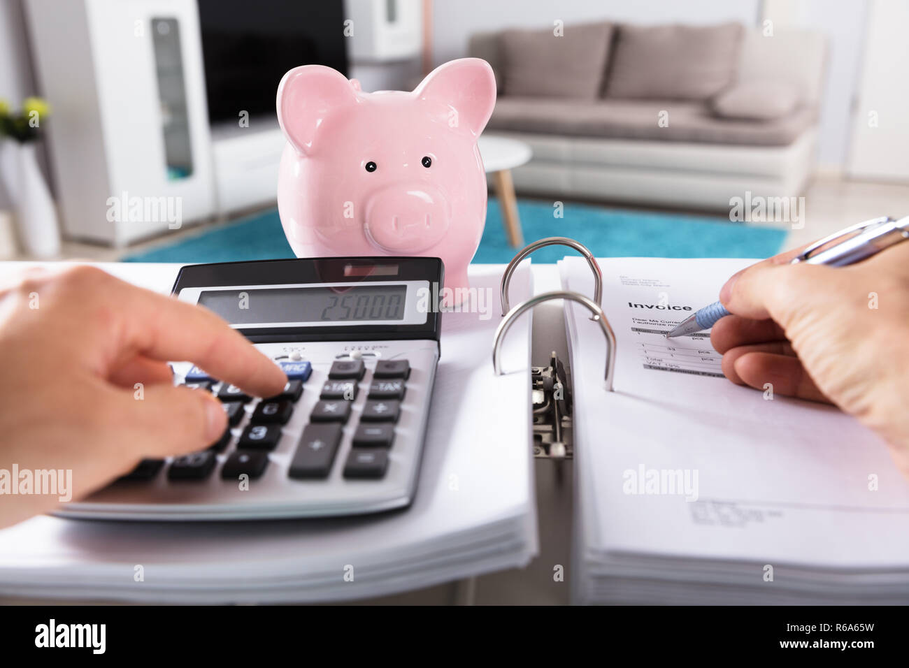 Person Calculating Invoice With Calculator Stock Photo - Alamy