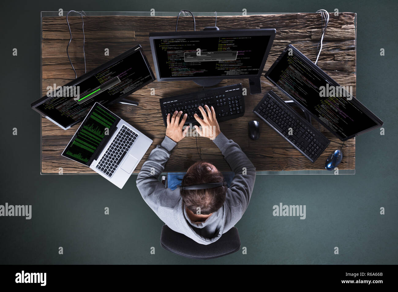Hacker Stealing Data From Multiple Computer Stock Photo - Alamy