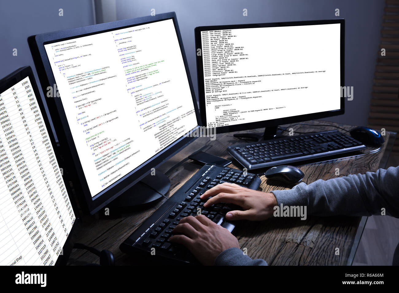 Hacker Stealing Information From Multiple Computers Stock Photo - Alamy
