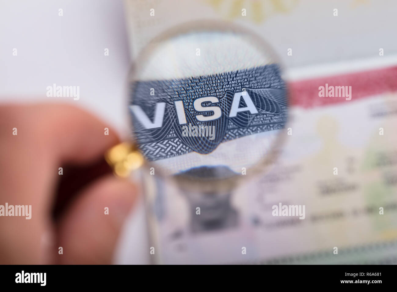 Human Hand Zooming At Visa Text Stock Photo - Alamy