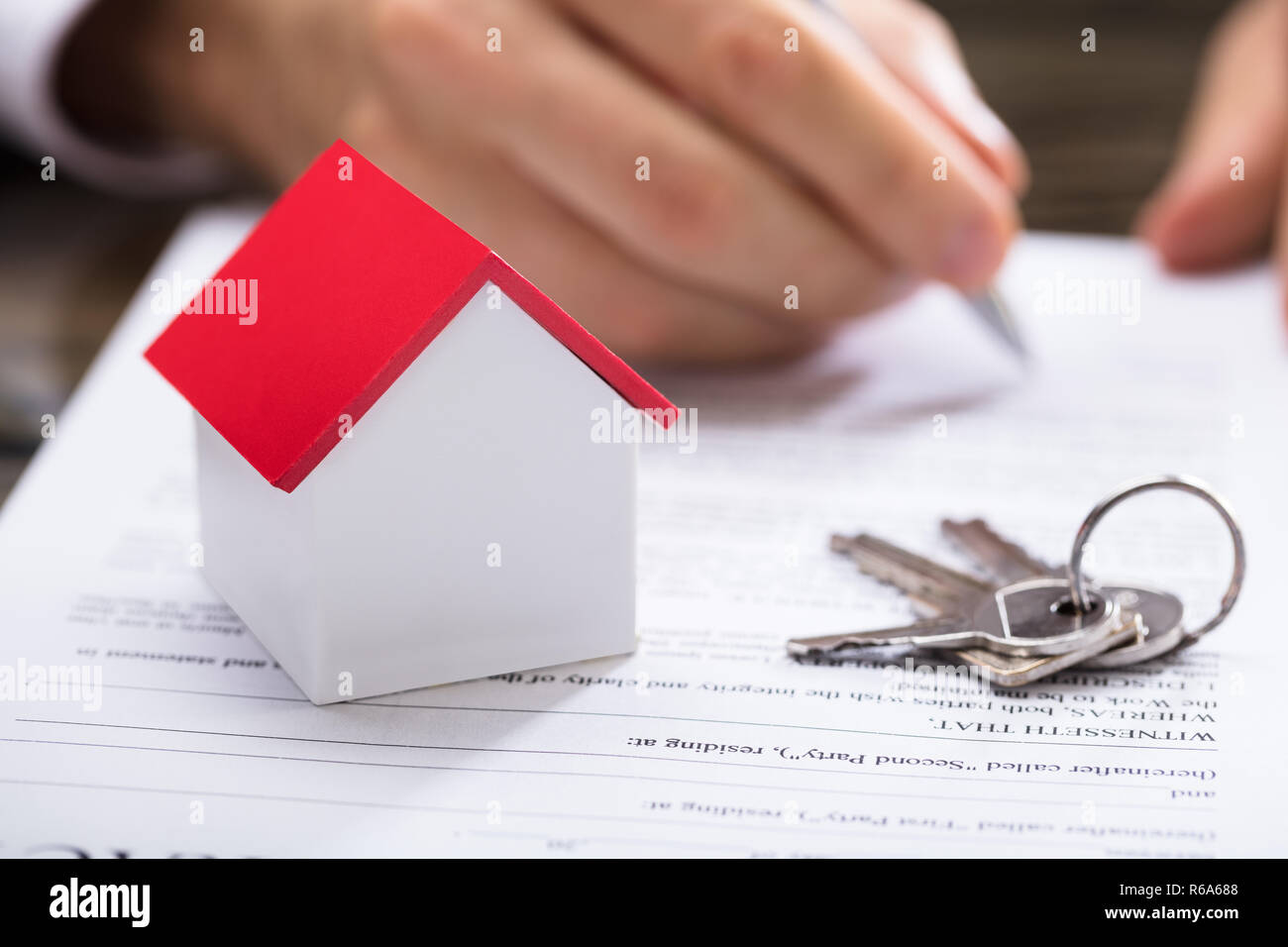 Businessperson Signing House Contract Stock Photo - Alamy