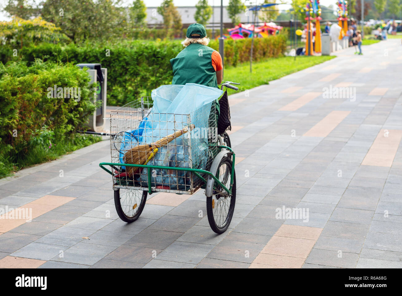 Cleaner sweeping uniform urban hi-res stock photography and images - Alamy