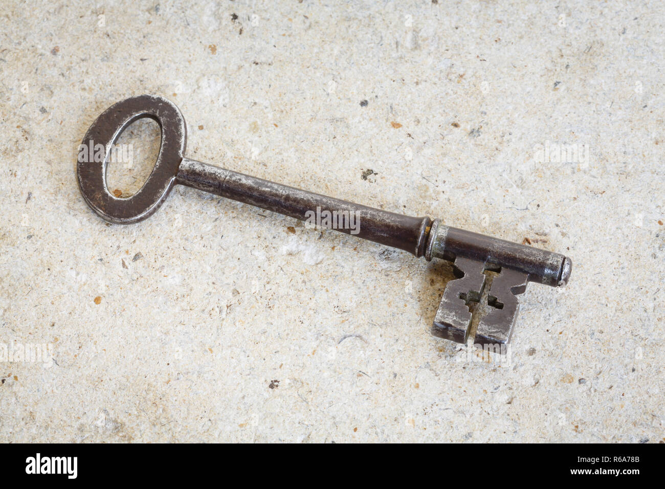 Traditional old key on a stone background Stock Photo - Alamy