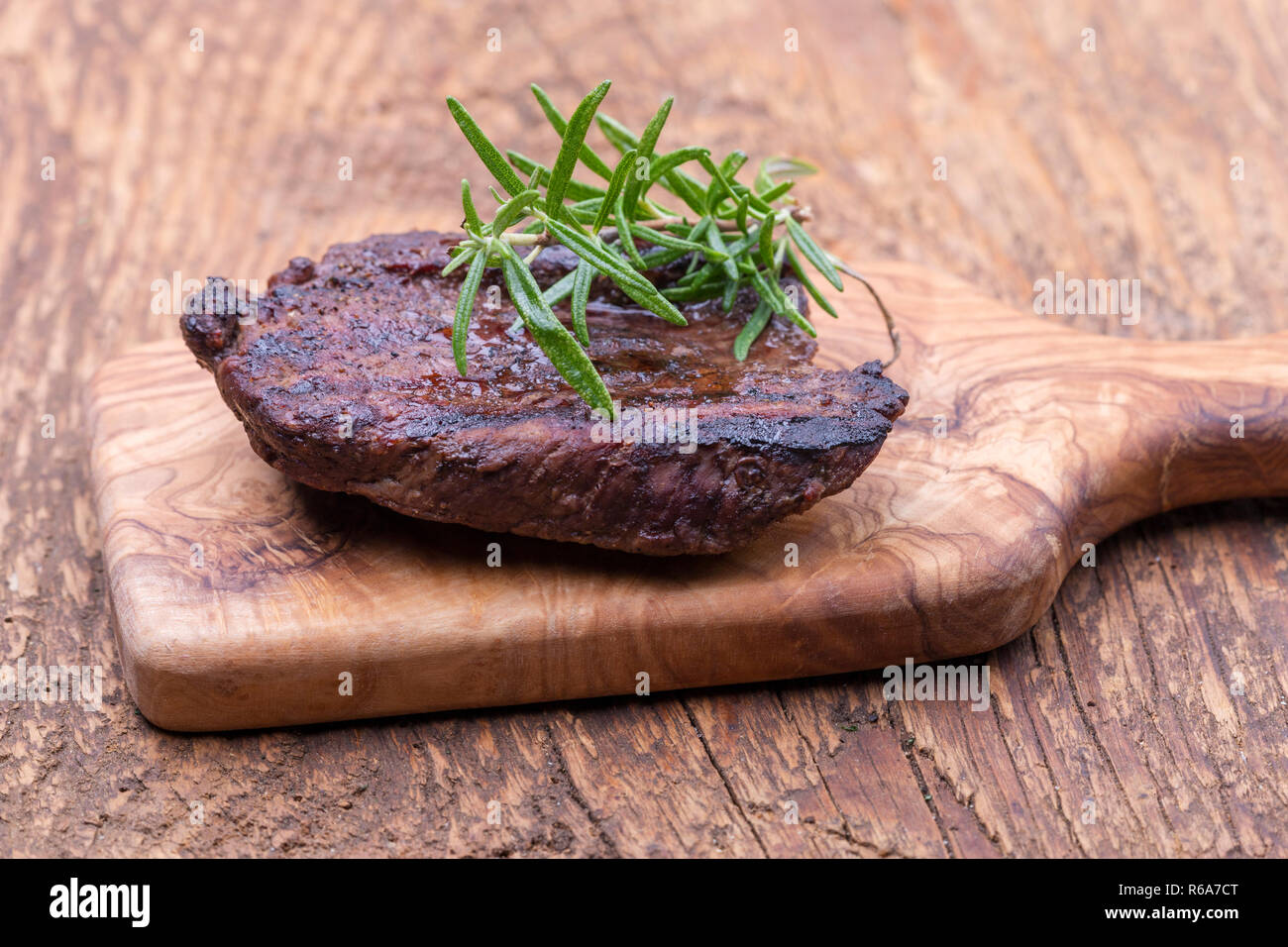 Tomahawk steak on wood board cooked hi-res stock photography and images ...