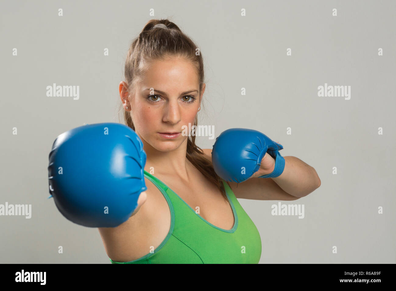 Young Woman With Boxing Gloves Showing Ready To Fight Stock Photo - Alamy