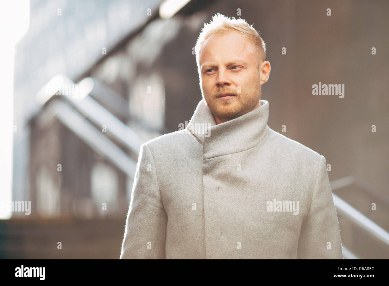 Thoughtful man in stylish coat hi-res stock photography and images - Alamy