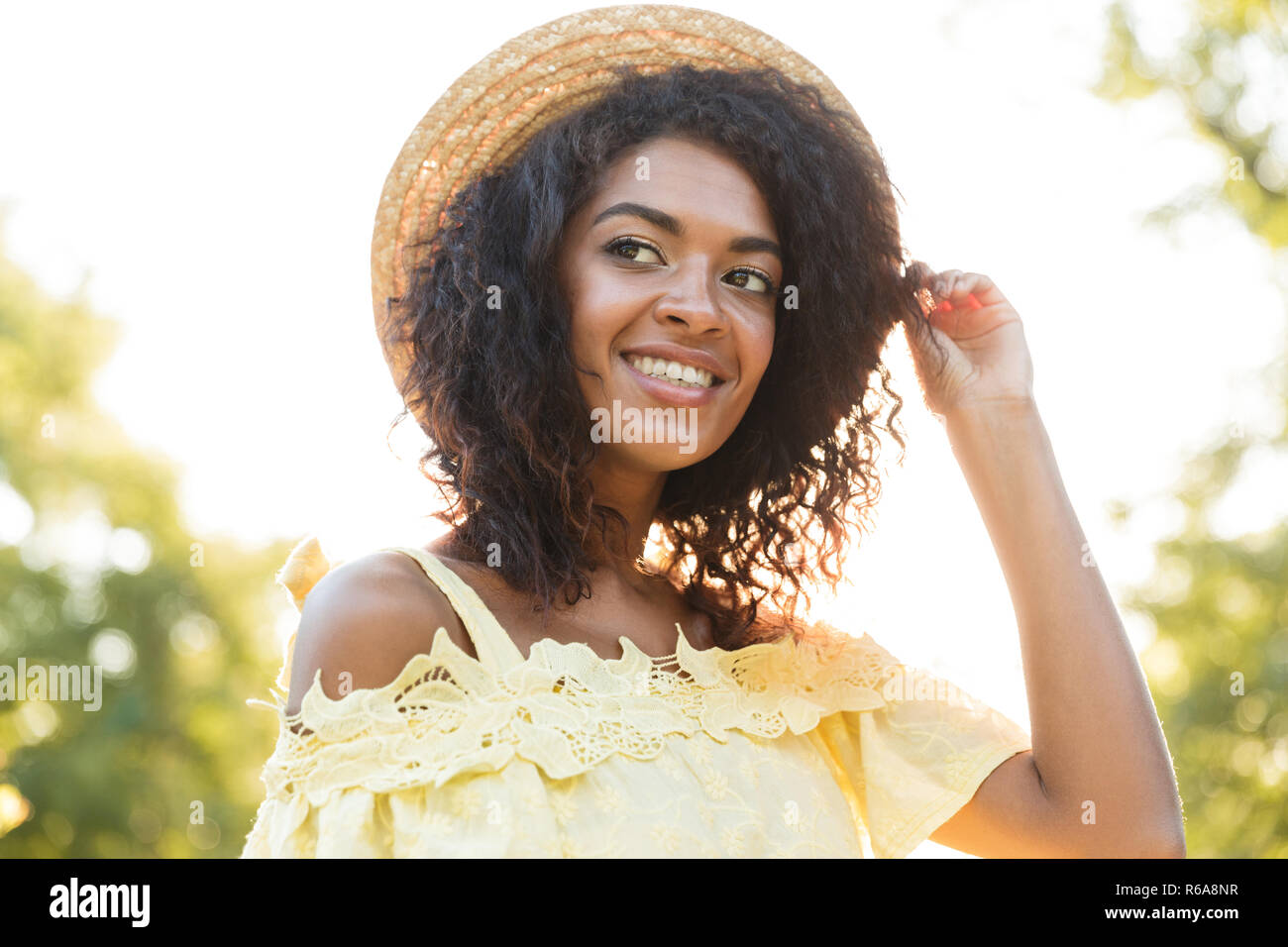 Photo of gorgeous african american woman 20s wearing straw hat and ...