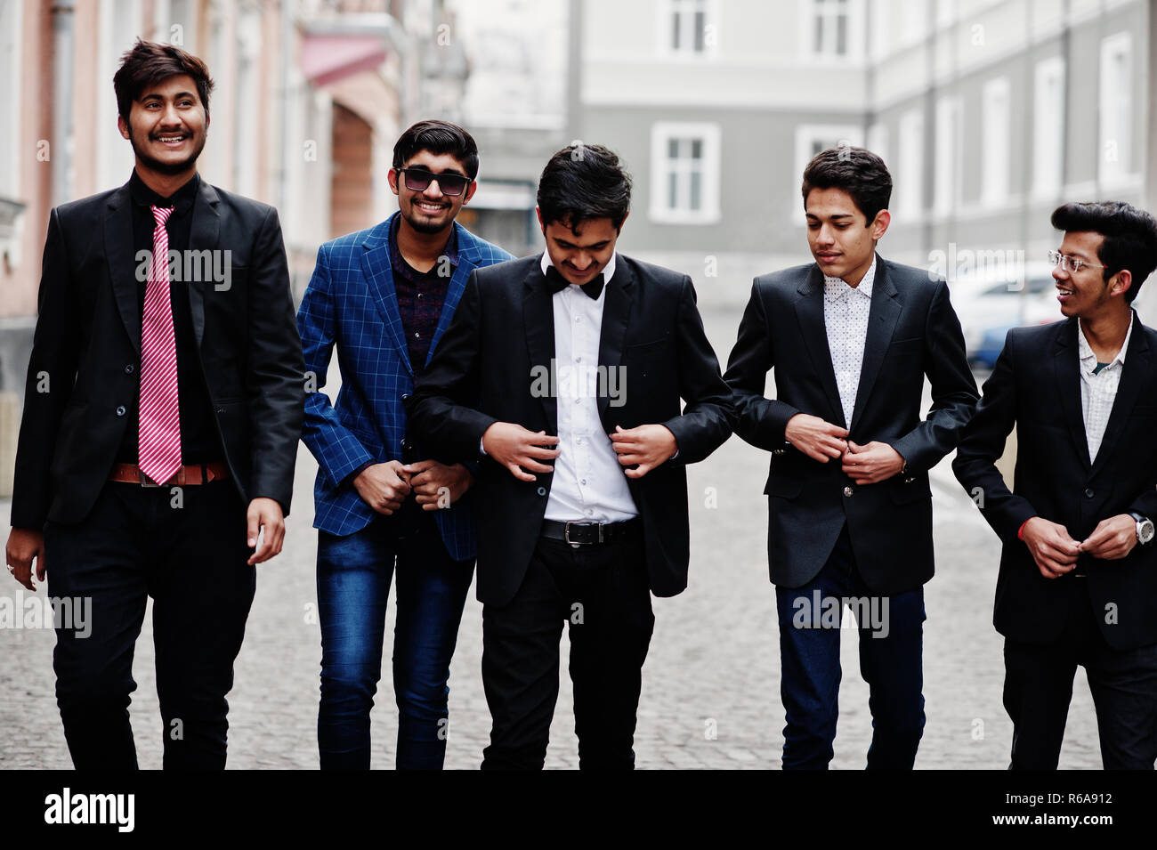 Group of 5 indian students in suits posed outdoor Stock Photo - Alamy
