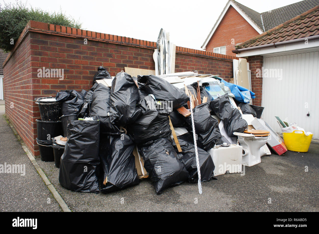 Stacks of waste bags outside a home in the UK Stock Photo - Alamy
