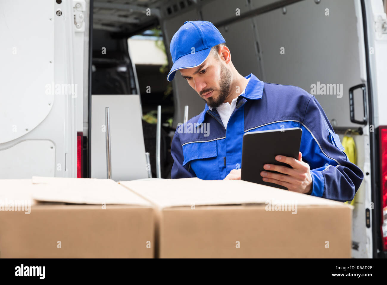 Male Worker Using Tablet Stock Photo - Alamy