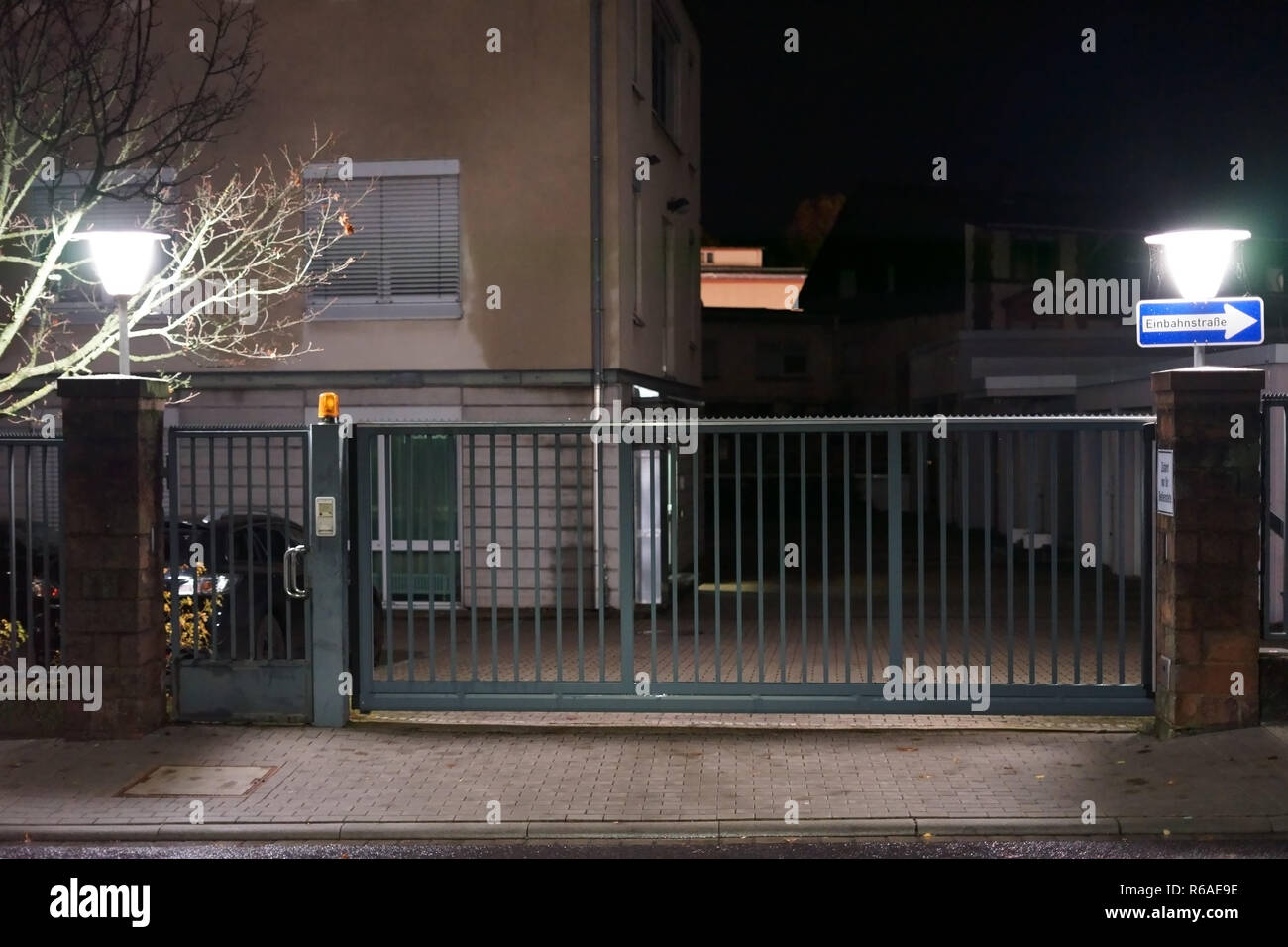Lighted Gate Entrance At Night Stock Photo - Alamy