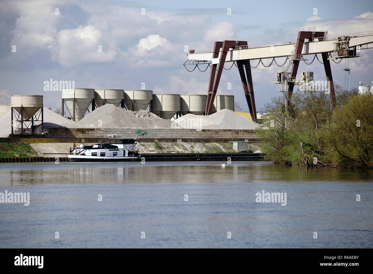 Inland Port With Crane And Construction Material Stock Photo - Alamy