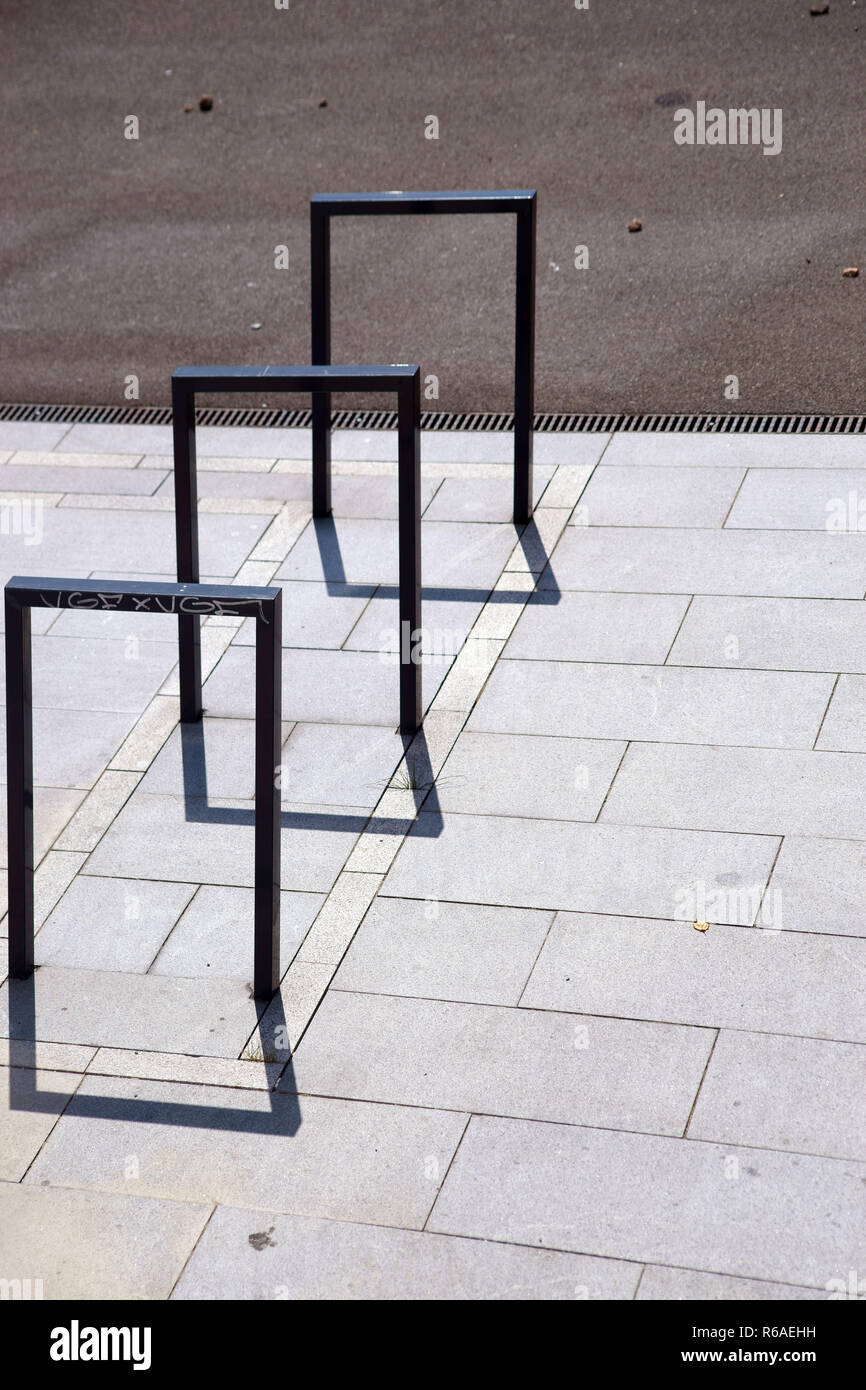Square Bike Racks Cast Shadows Stock Photo - Alamy