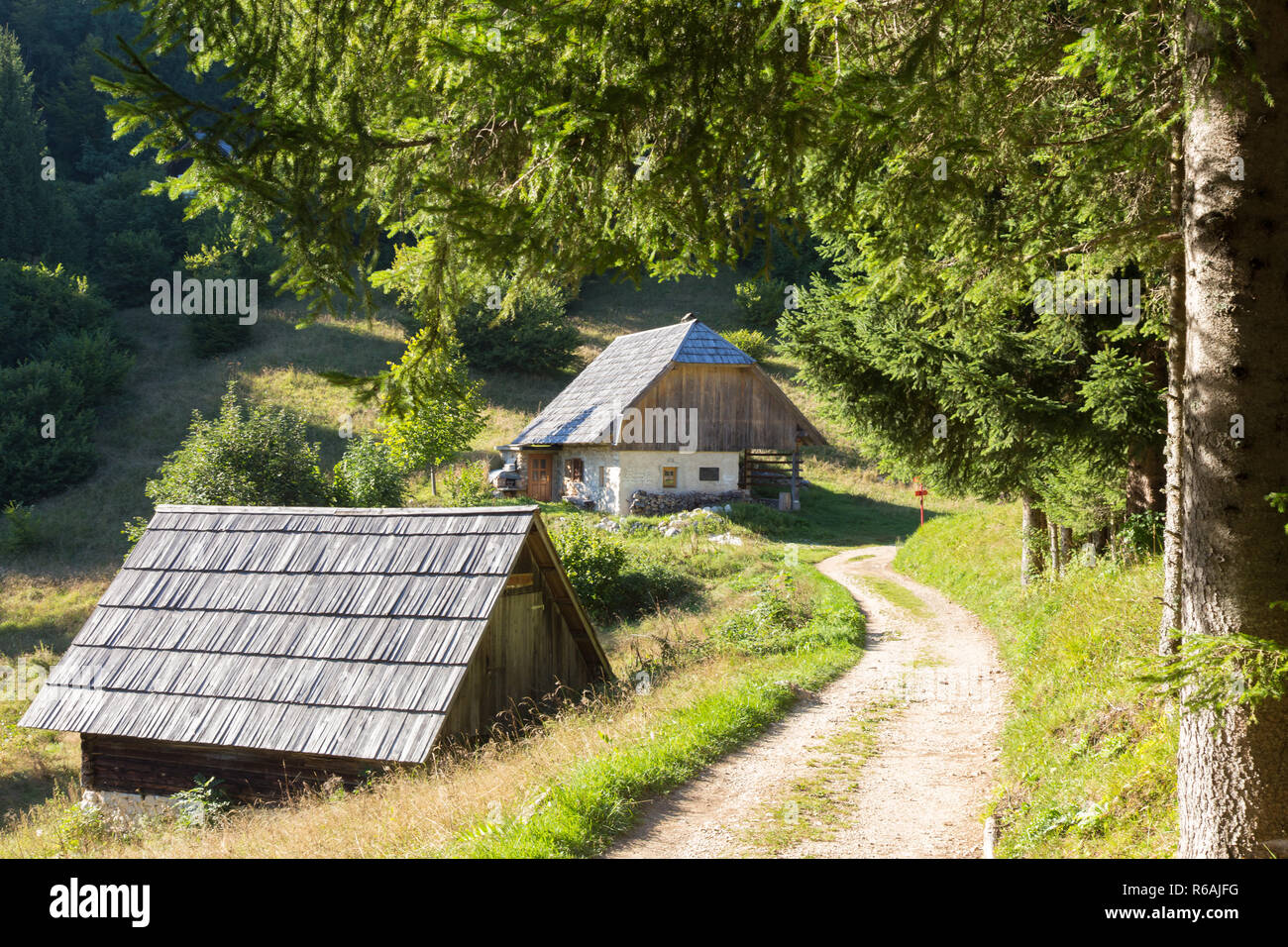 Traditional wooden hut cabin in mountain alps at rural landscape in ...