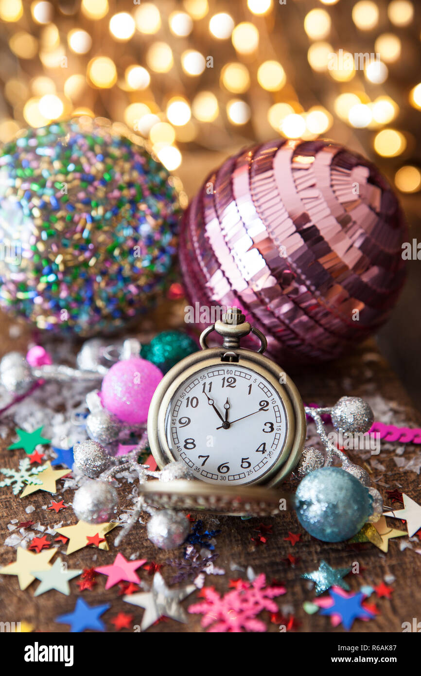 Watch Before Midnight With Festive Decorations Stock Photo - Alamy