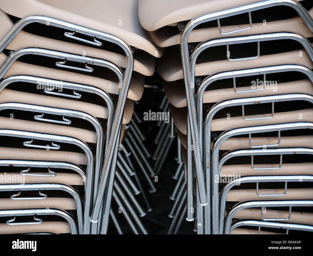 stack of plastic chairs in outdoor cafe Stock Photo - Alamy