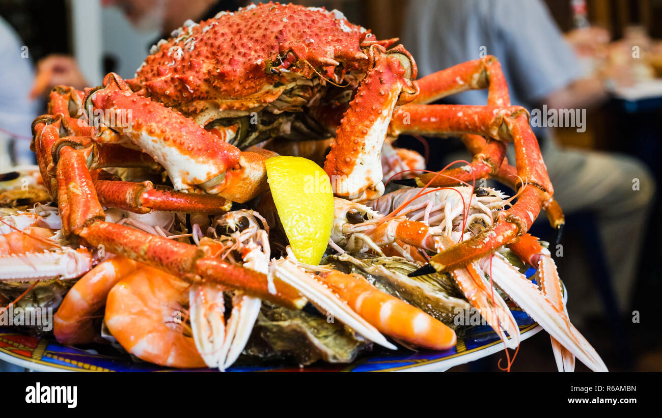 crab on seafood plate in local fish restaurant Stock Photo - Alamy