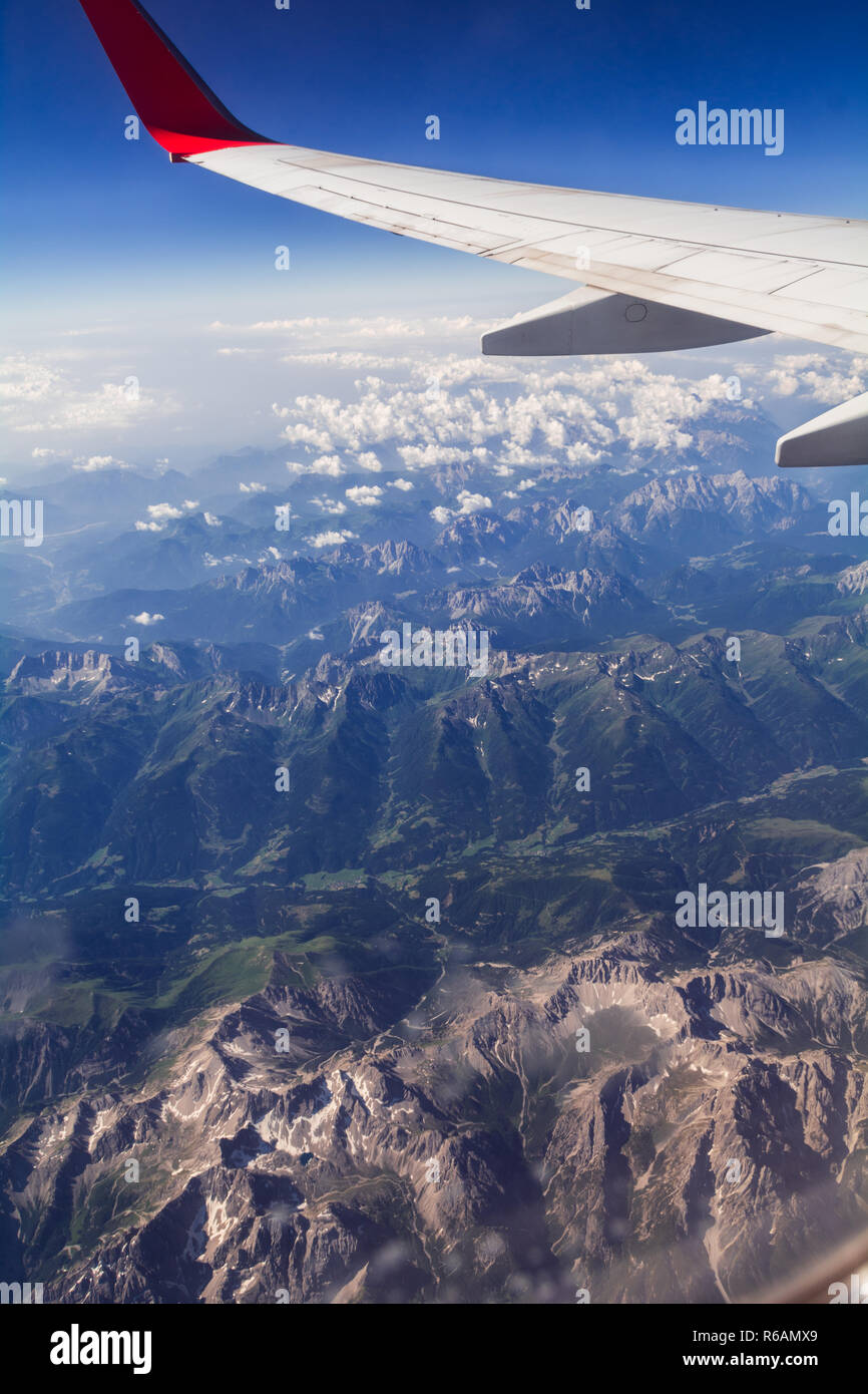 View from the airplane window on the Alps Stock Photo - Alamy