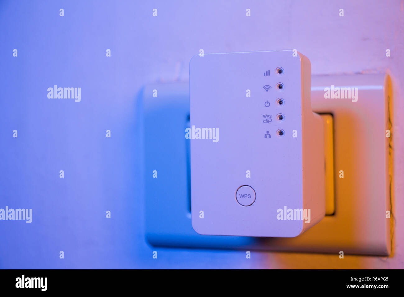 WiFi repeater in electrical socket on the wall Stock Photo - Alamy