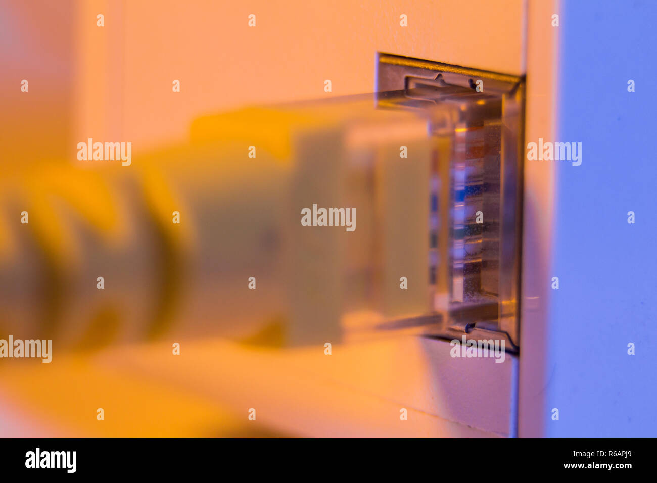 Macro close up of WiFi extender in electrical socket on the wall with ...