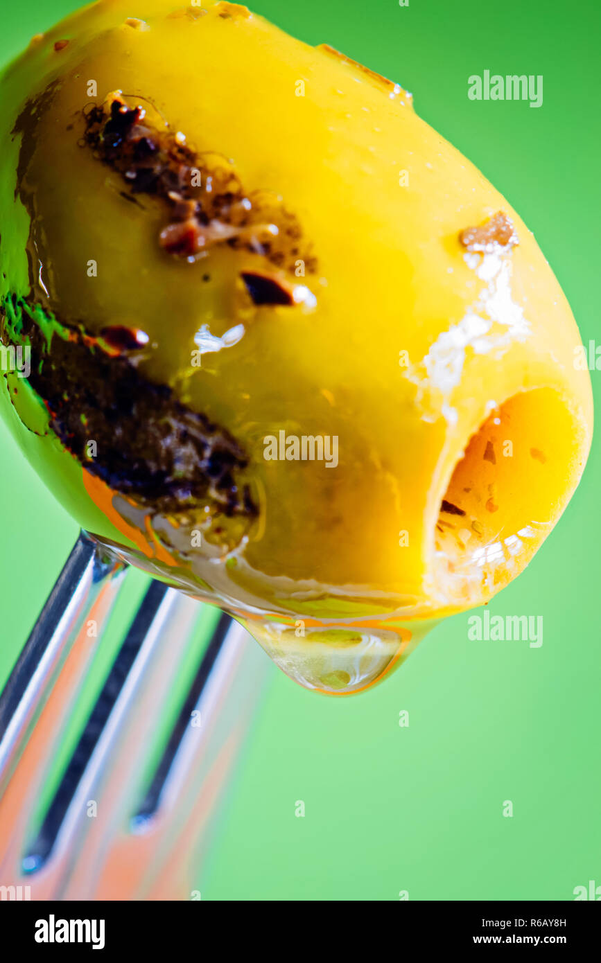 Closeup grilled olive on the fork Stock Photo - Alamy