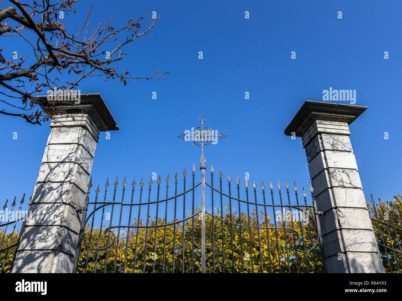 Iron gate with cross Stock Photo - Alamy