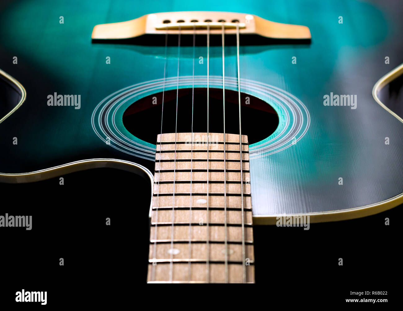 black and green color acoustic guitar Stock Photo - Alamy