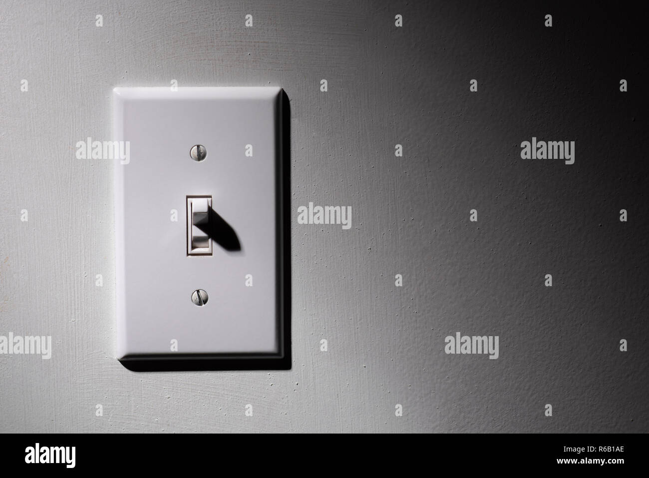 Light switch on the wall Stock Photo - Alamy