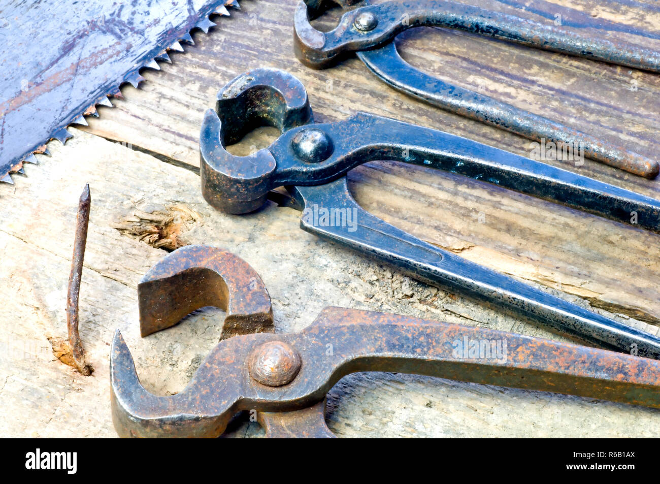 Old Rusty Pliers With Nail Stock Photo - Alamy