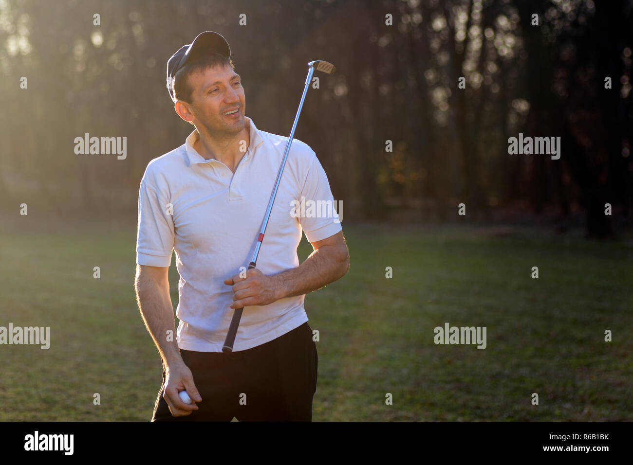 smiling playful golfer Stock Photo - Alamy