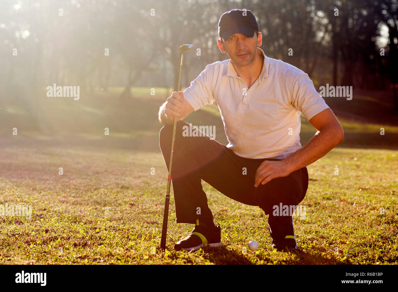 smiling playful golfer Stock Photo - Alamy
