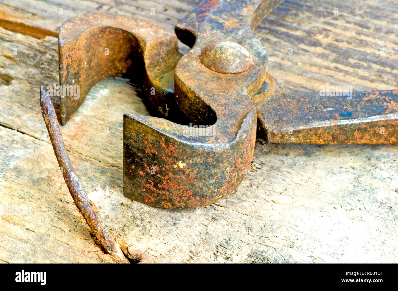 Old Rusty Pliers With Nail Stock Photo - Alamy