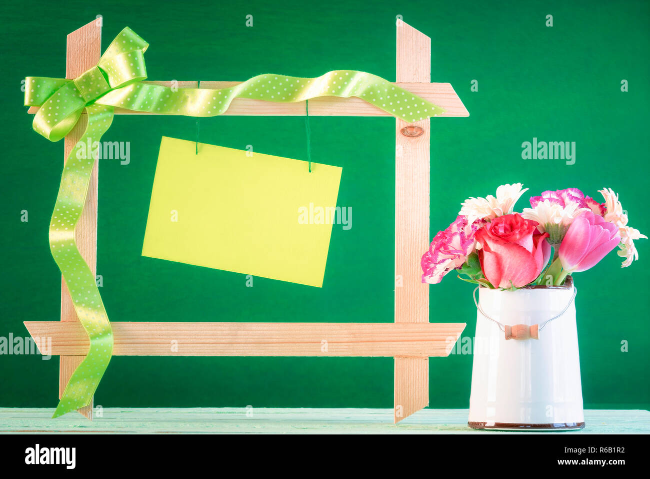 Flowers and frame with message card Stock Photo - Alamy