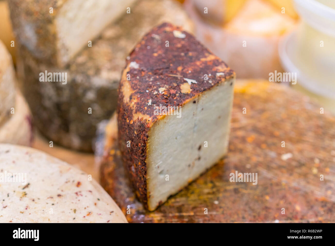 Craft cheese. Cheese head. Artisan cheese Stock Photo - Alamy