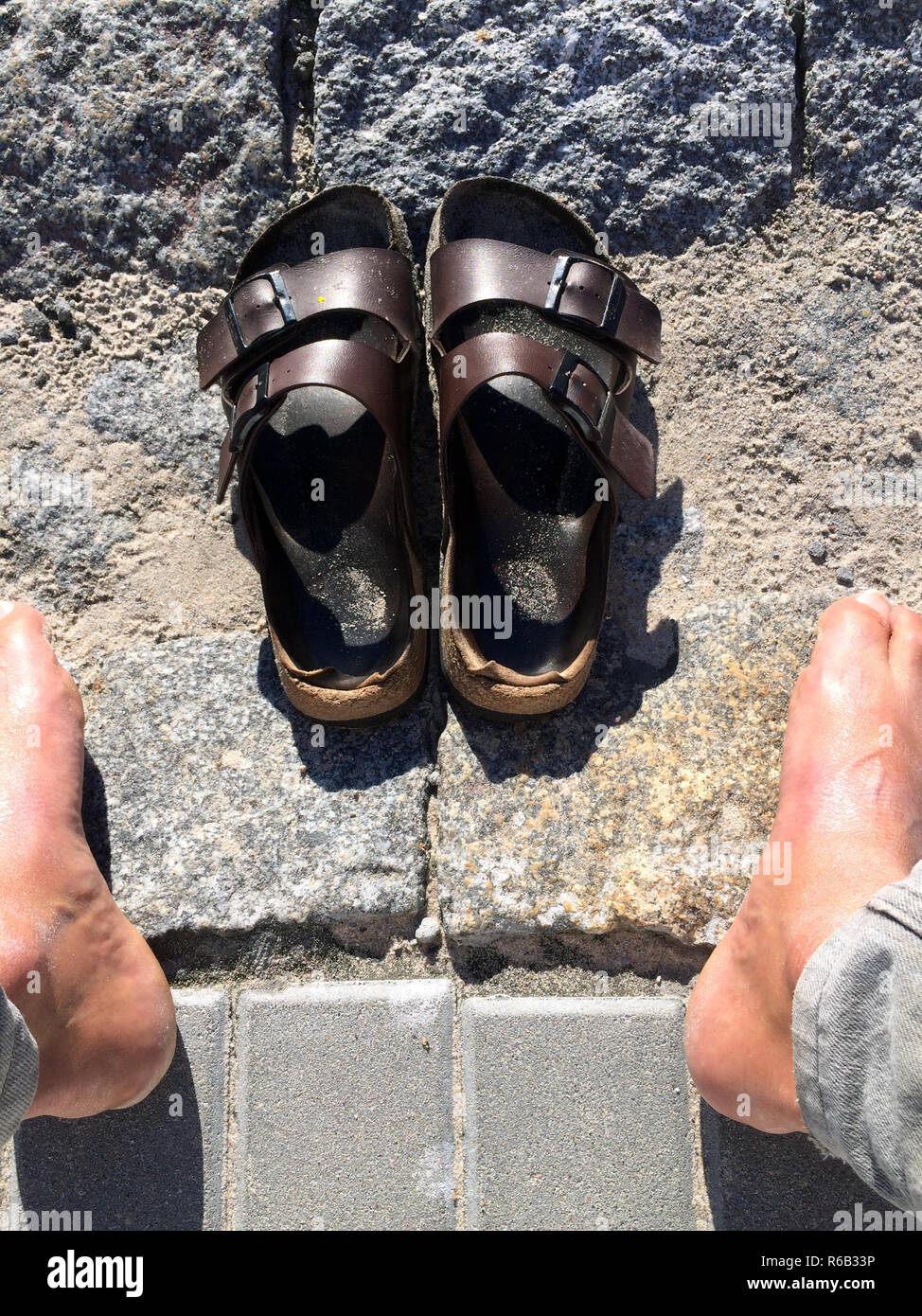 Man feet in sandals hi-res stock photography and images - Alamy