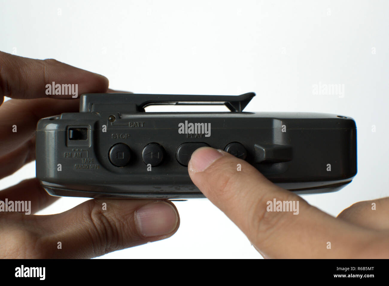 A man is holding walkman player against white background Stock Photo ...