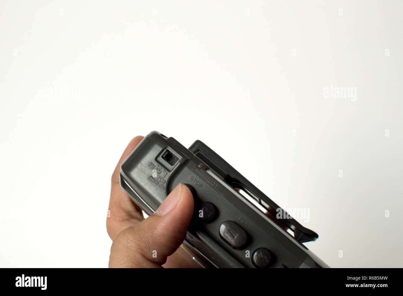 A man is holding walkman player against white background Stock Photo ...