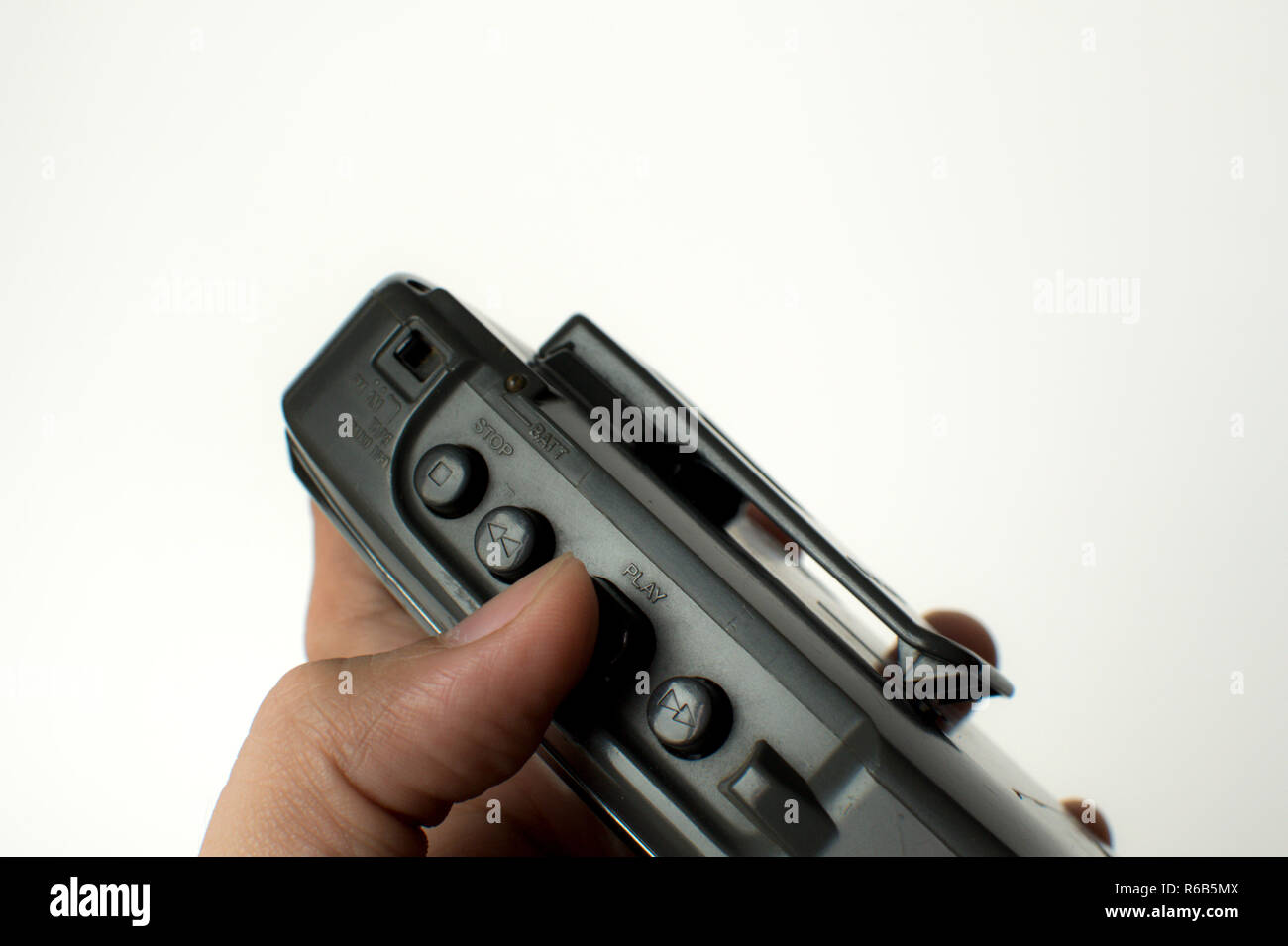 A man is holding walkman player against white background Stock Photo ...