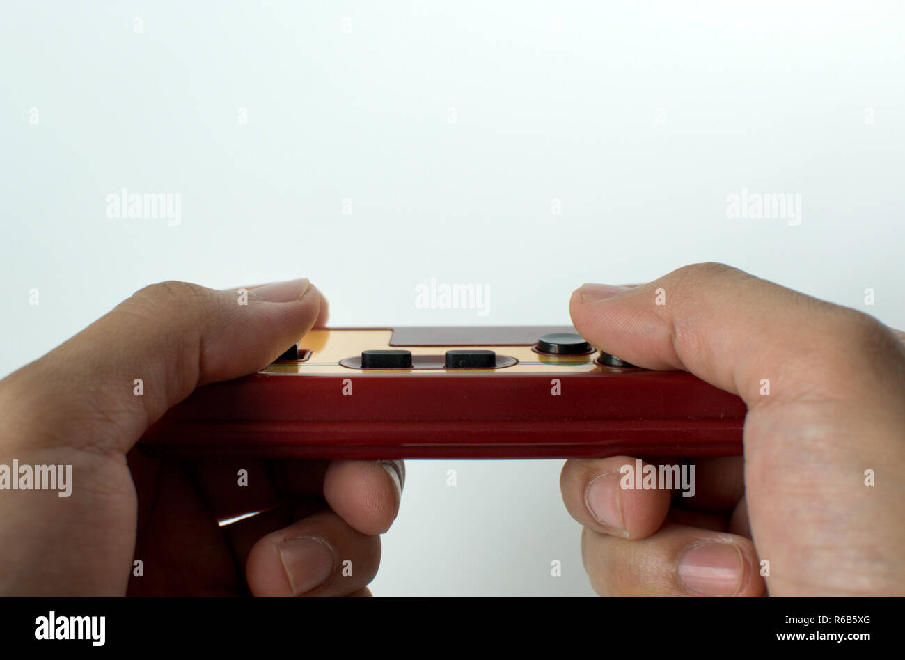 Holding a vintage computer game console Stock Photo - Alamy